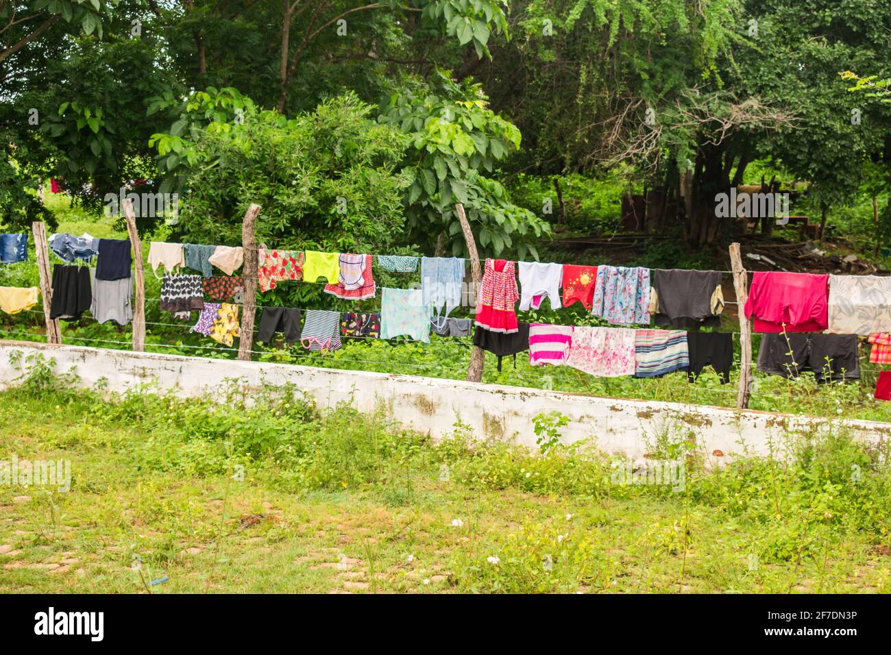 Colorful clothes hanging out to dry on a fence in Oeiras, Piaui ...
