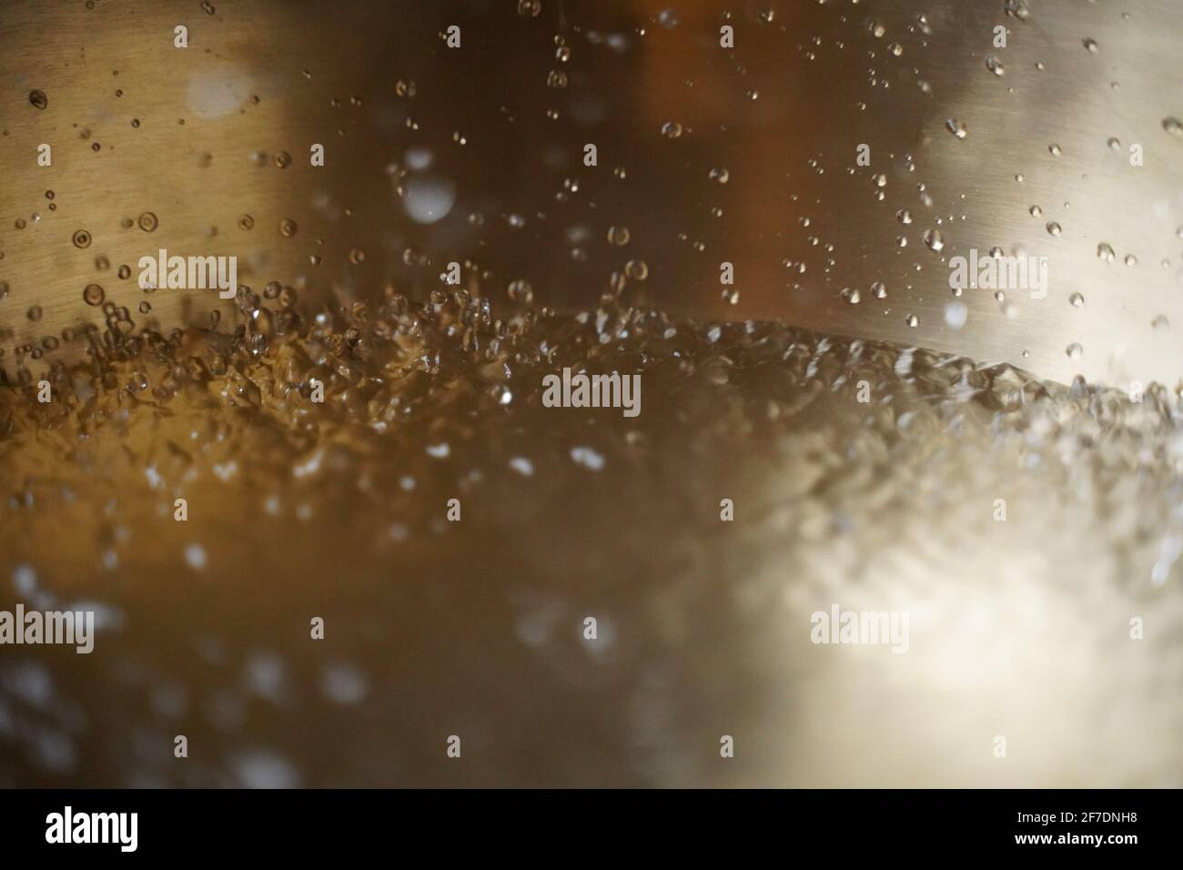 Tibetan singing bowl full of water close up water drops, sound healing ...
