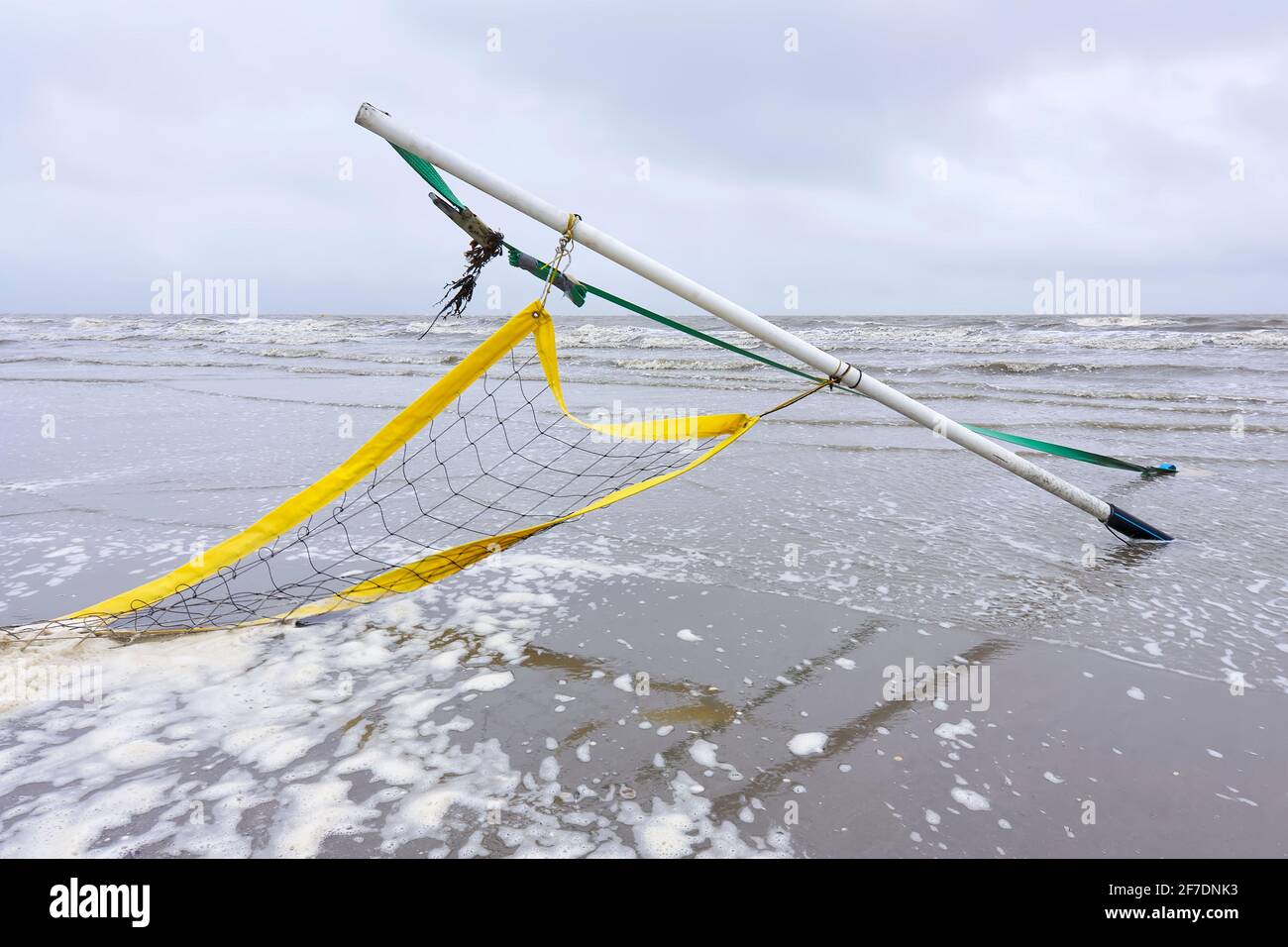 Blown over and destroyed volleyball net during a storm on a beach by ...
