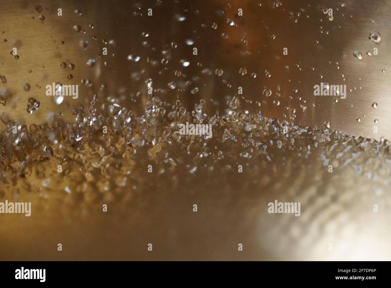 Tibetan singing bowl full of water close up water drops, sound healing ...