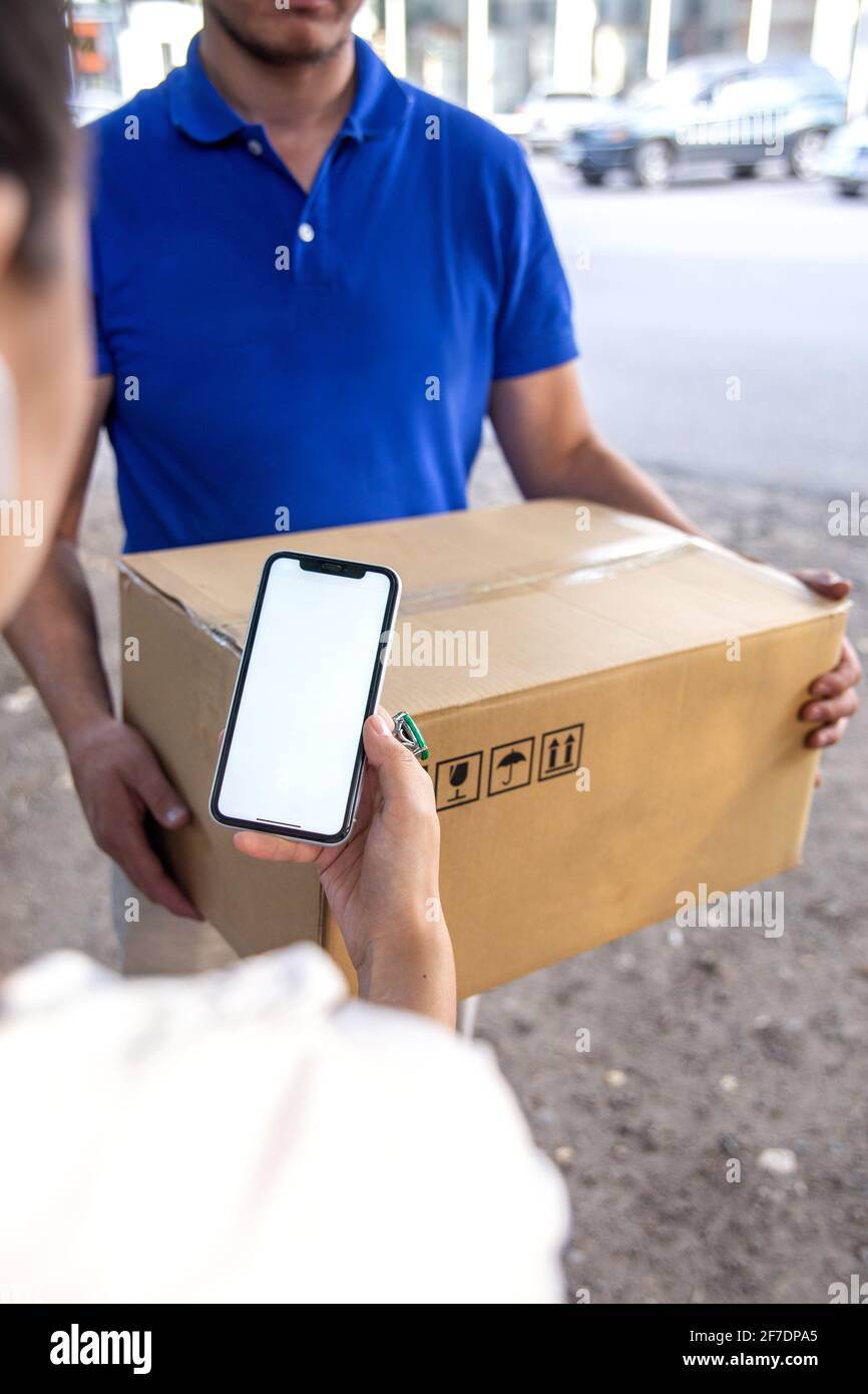 delivery of goods by courier Stock Photo - Alamy
