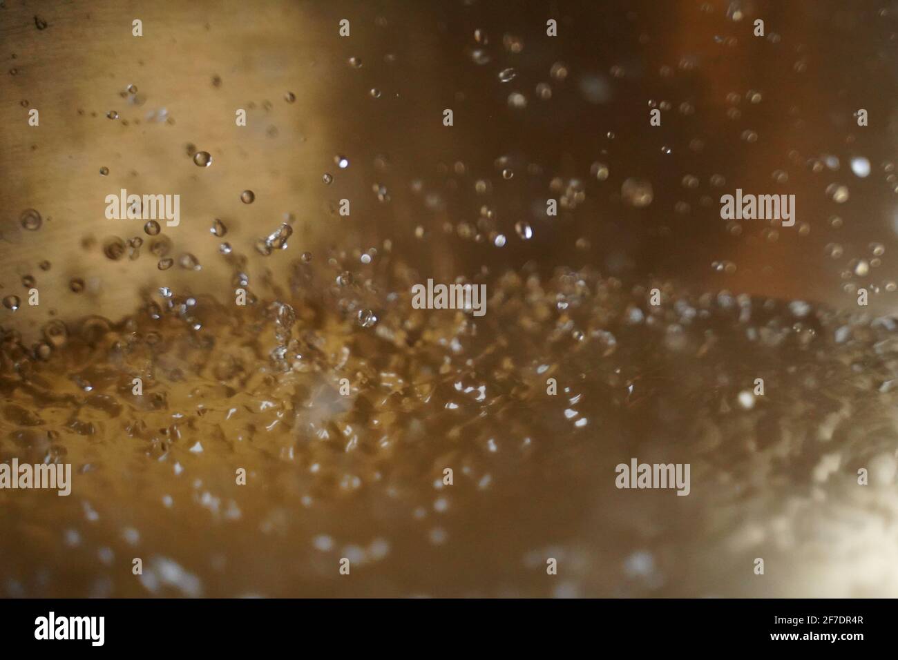 Tibetan singing bowl full of water close up water drops, sound healing ...