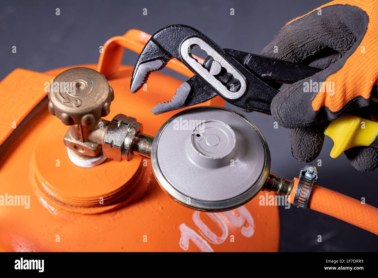 Installation of the reducer to the gas cylinder. Installation work on ...