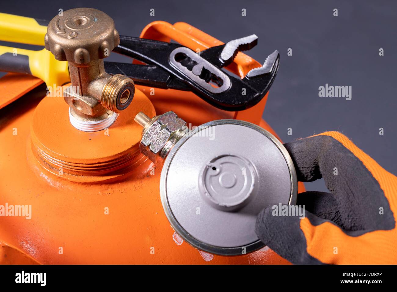 Installation of the reducer to the gas cylinder. Installation work on ...