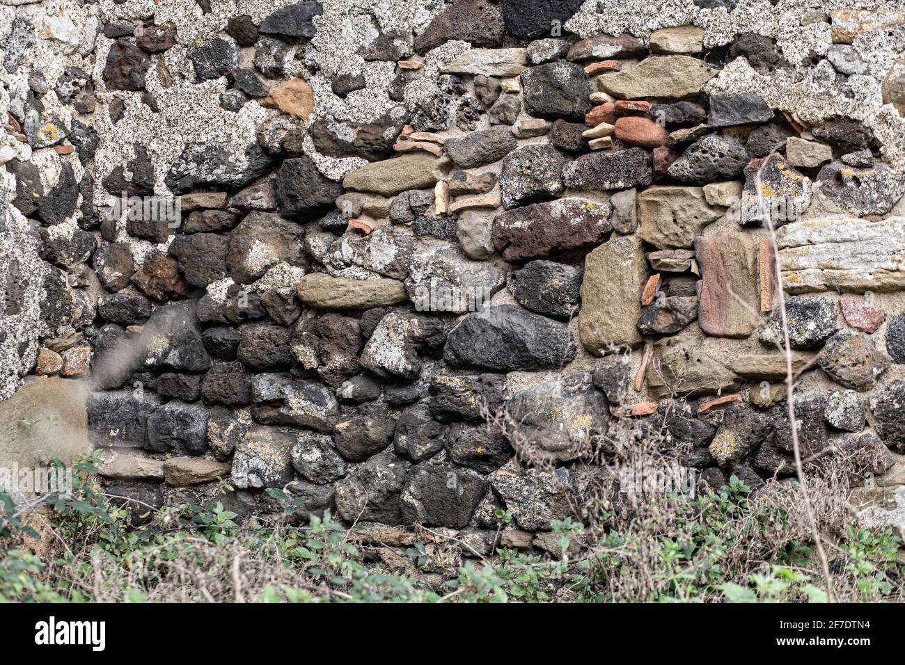 Old ruined cobble stone rock wall texture Stock Photo - Alamy