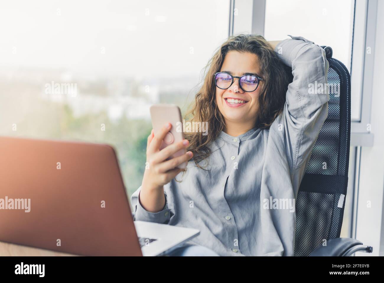 Girl making a video call at the office Stock Photo - Alamy