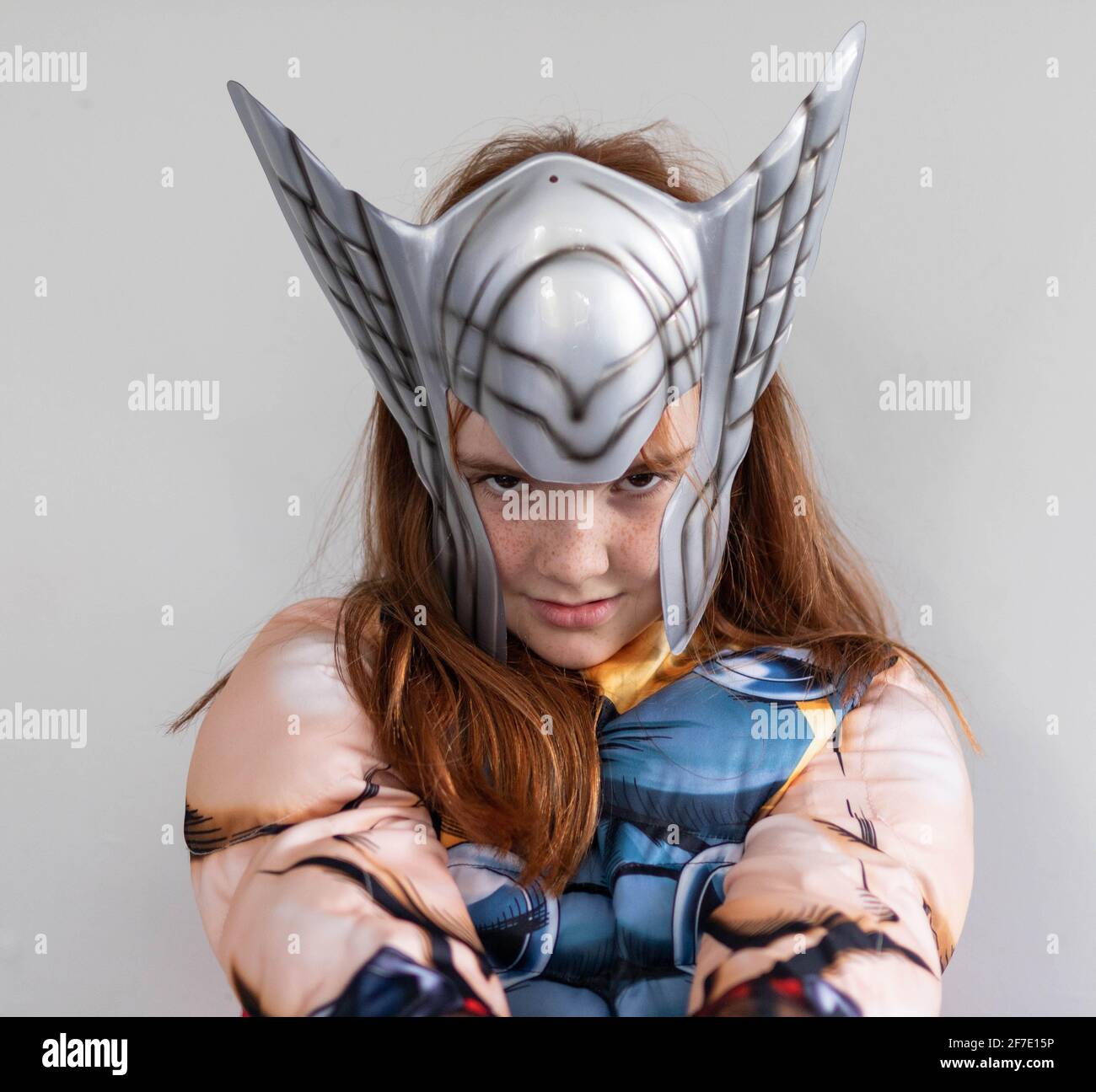 young Girl red hair dressed as Super hero Thor from Marvel and Avengers ...