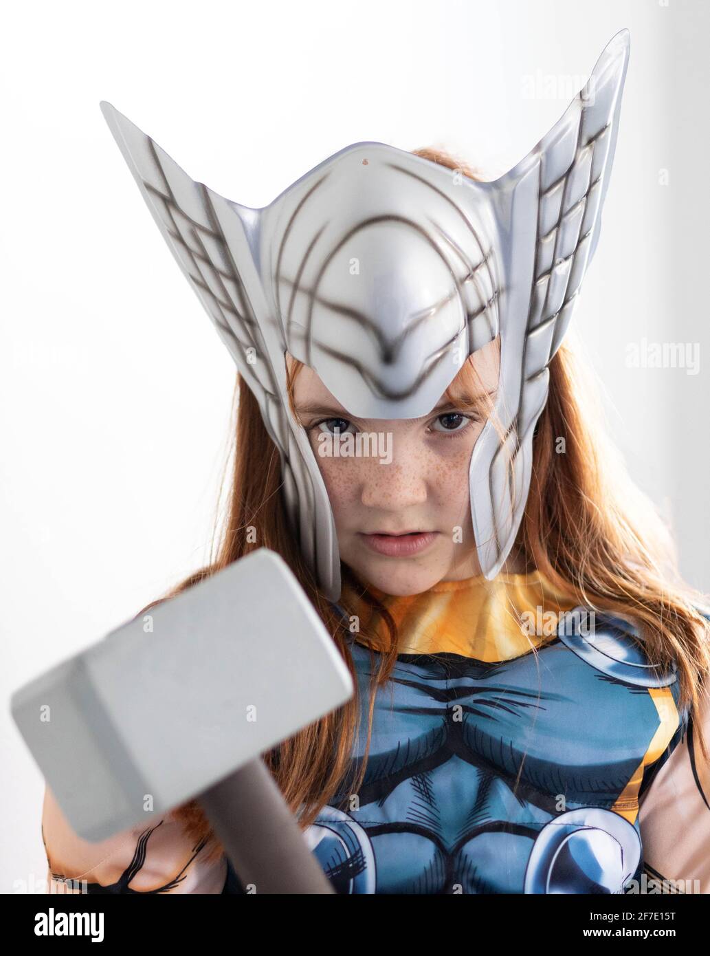 young Girl red hair dressed as Super hero Thor from Marvel and Avengers ...