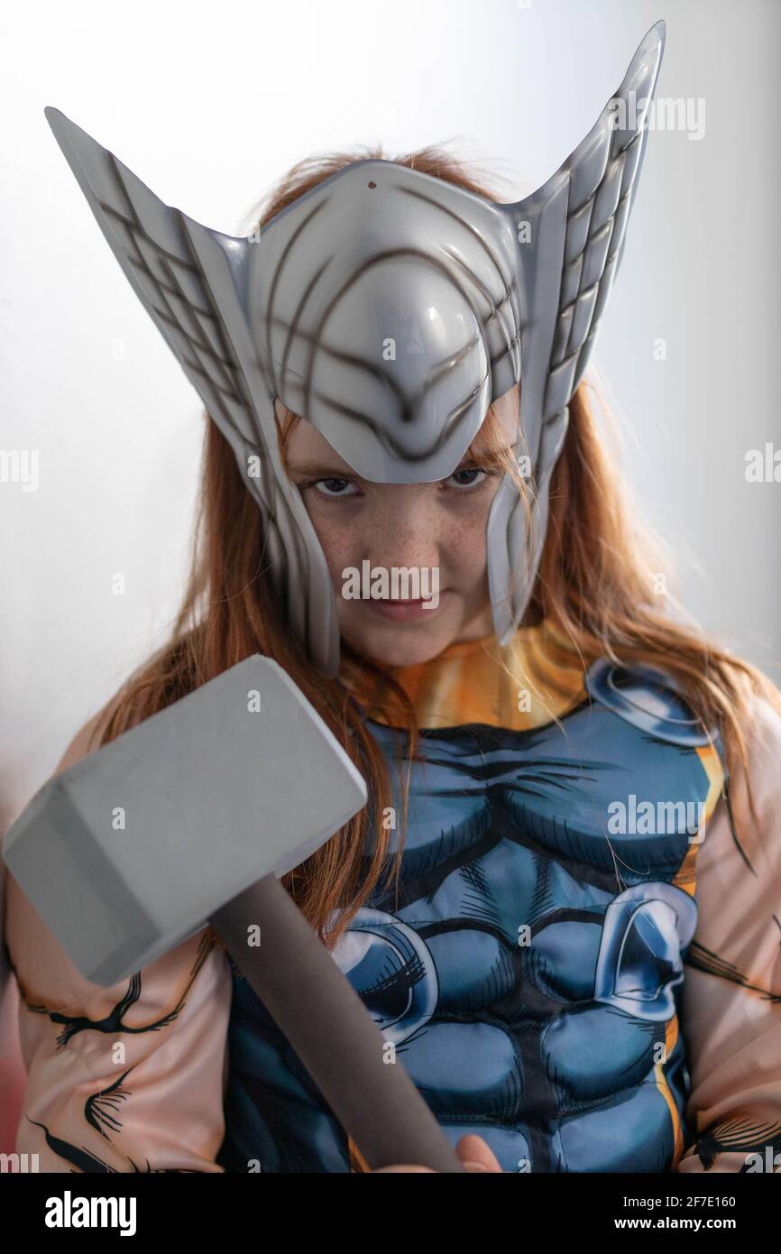 young Girl red hair dressed as Super hero Thor from Marvel and Avengers ...