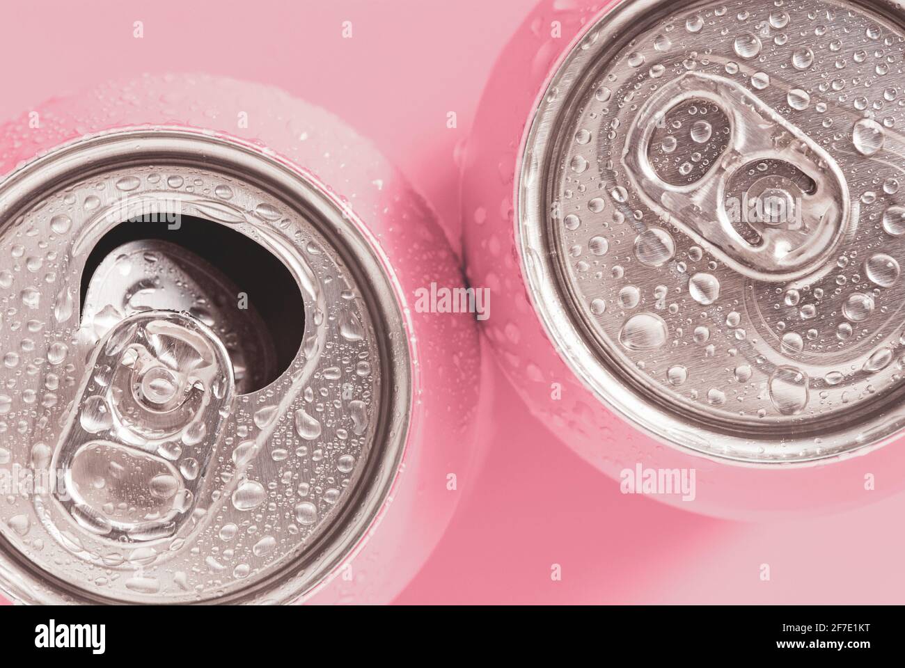 Pink soda cans in water drops, top view Stock Photo - Alamy