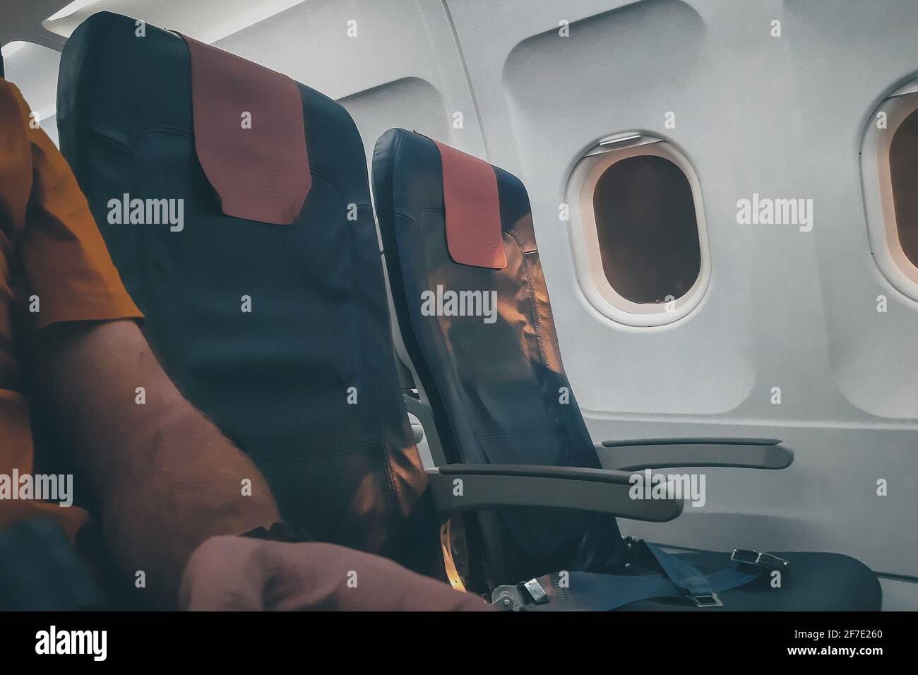 Empty row of seats on a plane next to mine. Happy moment when there is ...