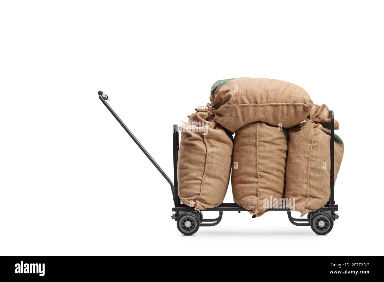Side shot of burlap sacks on a hand truck isolated on white background ...