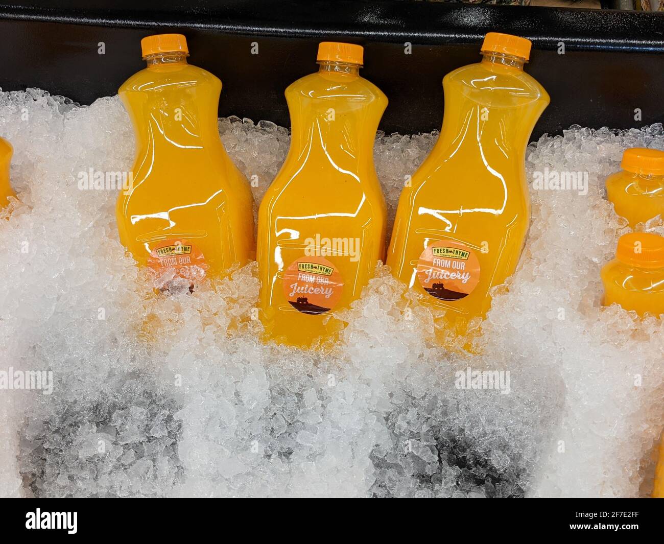 Delicious Bottles of Orange Juice Available for Purchase Stock Photo ...