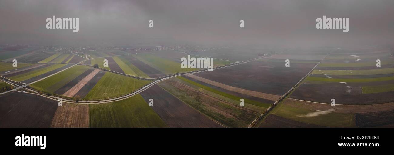 Wet agricultural fields from high perspective. Rainy season in autumn ...