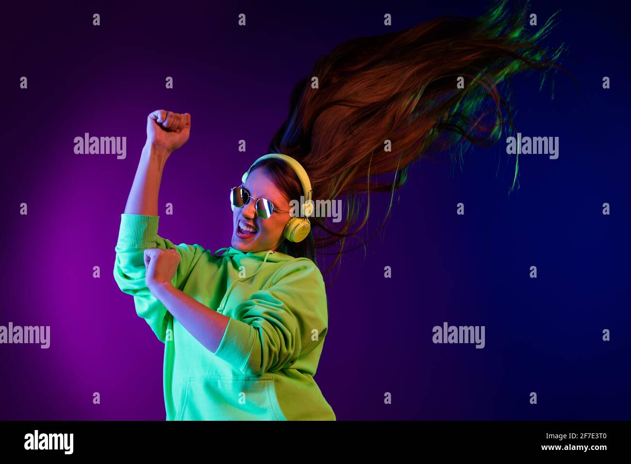 Photo of crazy funky young girl dance party mood wear headset isolated ...