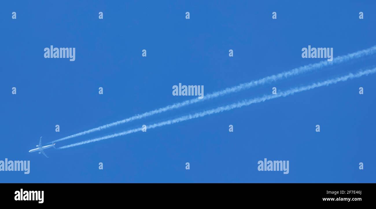 inversion trace of an airplane in the sky Stock Photo - Alamy
