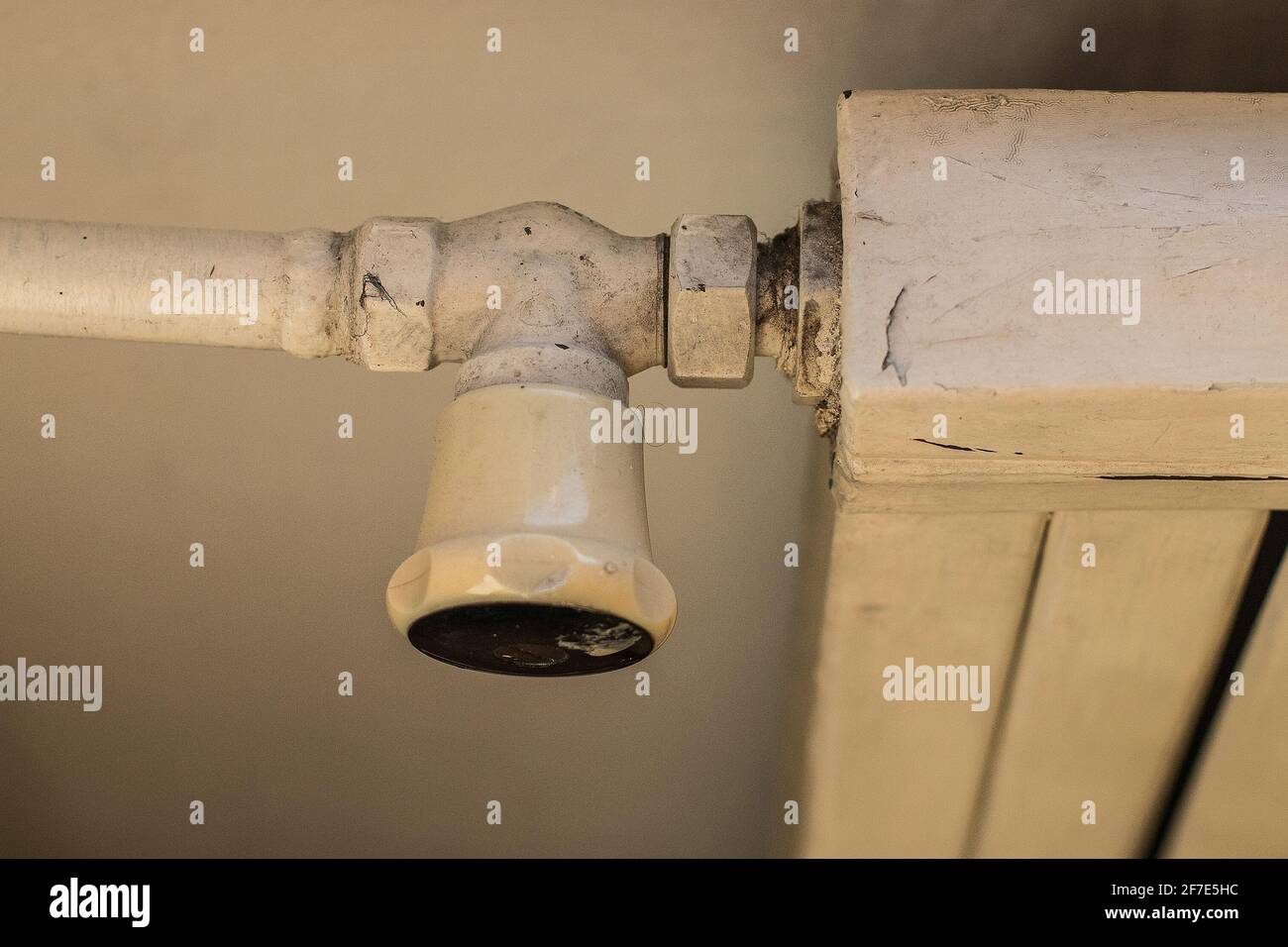 Old radiator heater valve and knob. Top view Stock Photo - Alamy