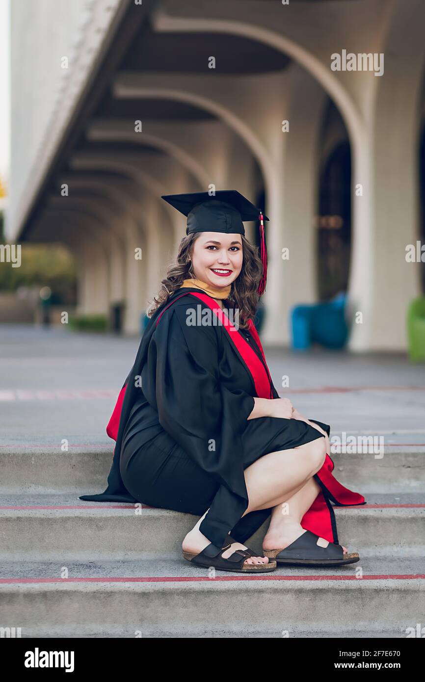 Young woman graduating college, wearing a graduation gown/cap Stock ...