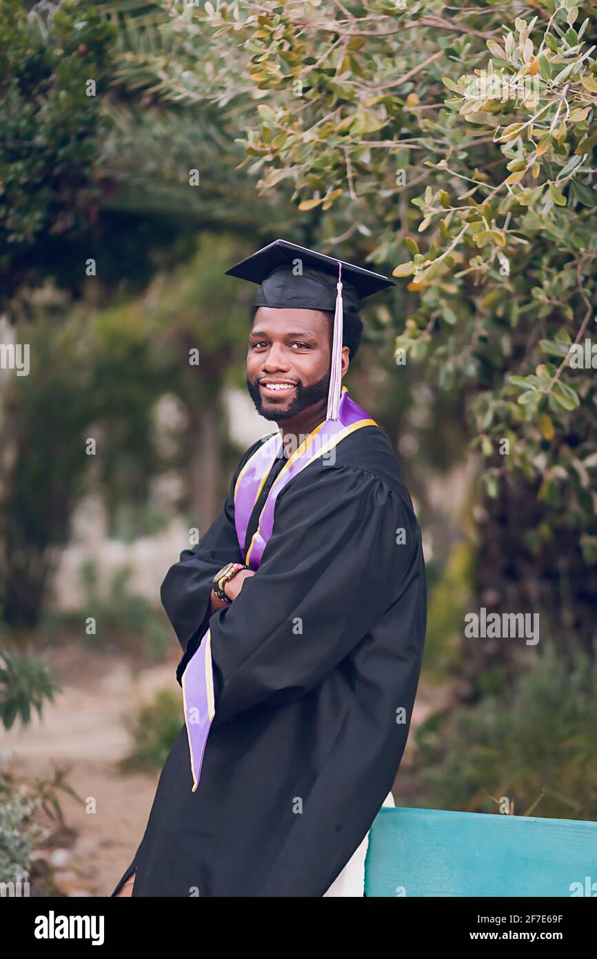 Graduate man arms crossed hi-res stock photography and images - Alamy