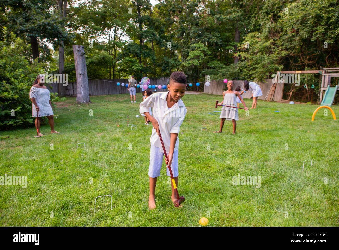 Children playing cricket at lawn party Stock Photo - Alamy