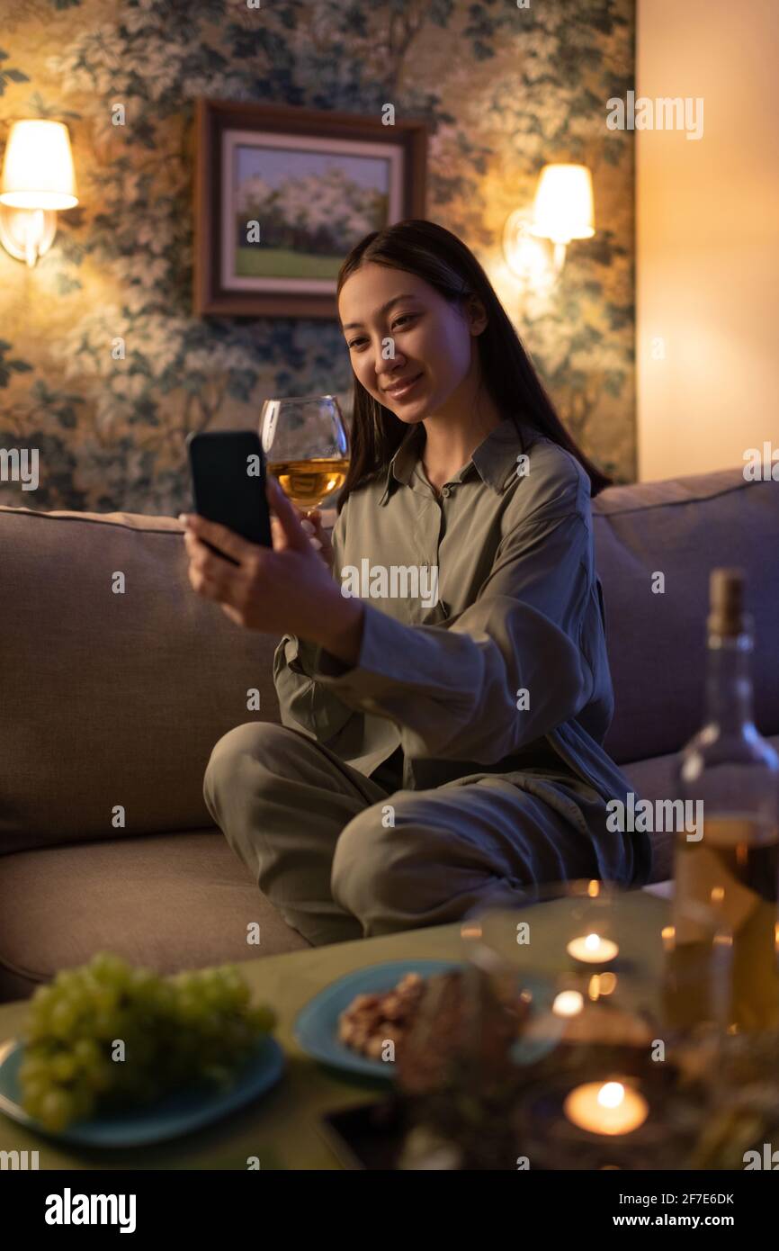 Asian woman having online romantic date Stock Photo - Alamy