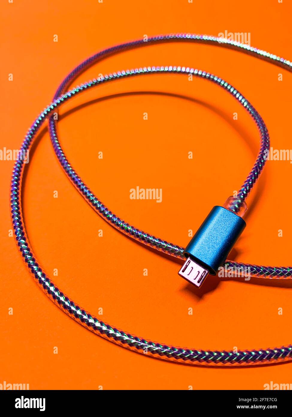 blue cord on contrasting orange background in vertical layout Stock ...