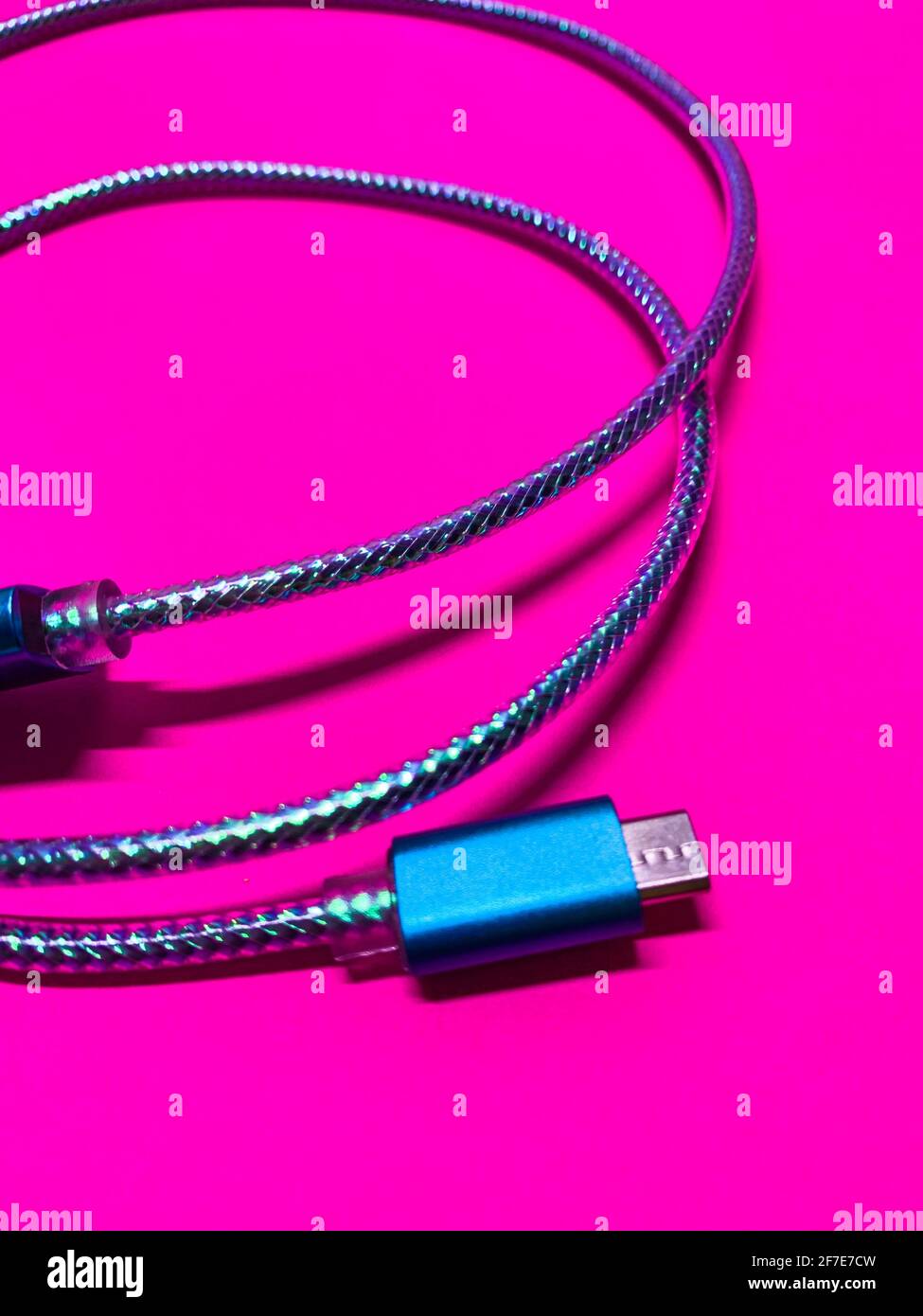blue cord on pink background close-up vertical layout Stock Photo - Alamy
