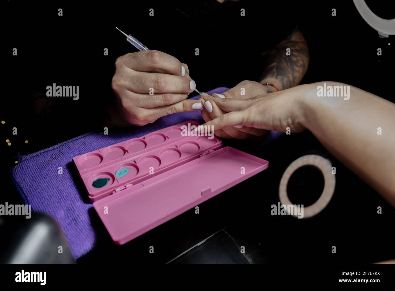 Man painting finger nails hi-res stock photography and images - Alamy
