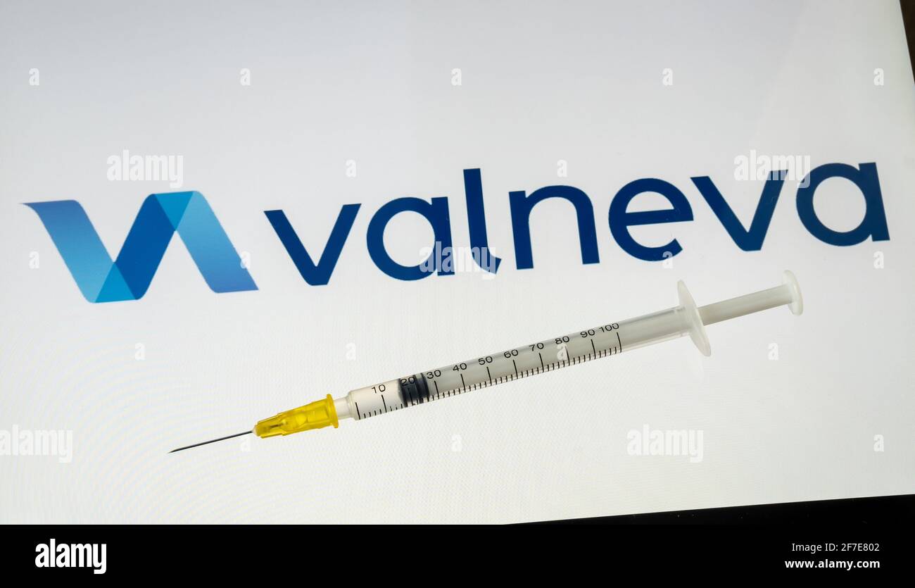 Valneva COVID-19 vaccine concept. Syringe and Valneva company logo on ...