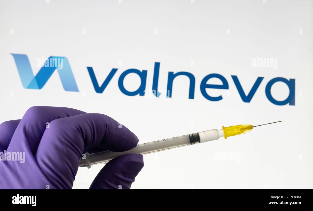Valneva COVID-19 vaccine concept. Syringe and Valneva company logo on ...