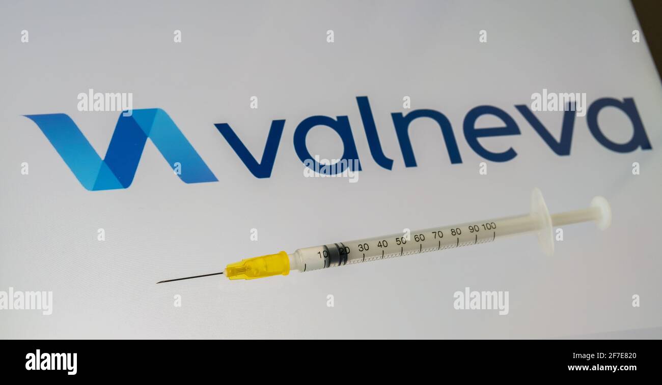 Valneva COVID-19 vaccine concept. Syringe and Valneva company logo on ...