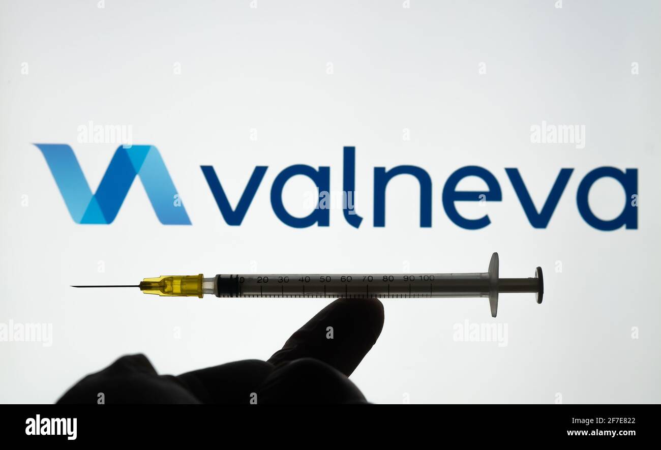 Valneva COVID-19 vaccine concept. Syringe and Valneva company logo on ...