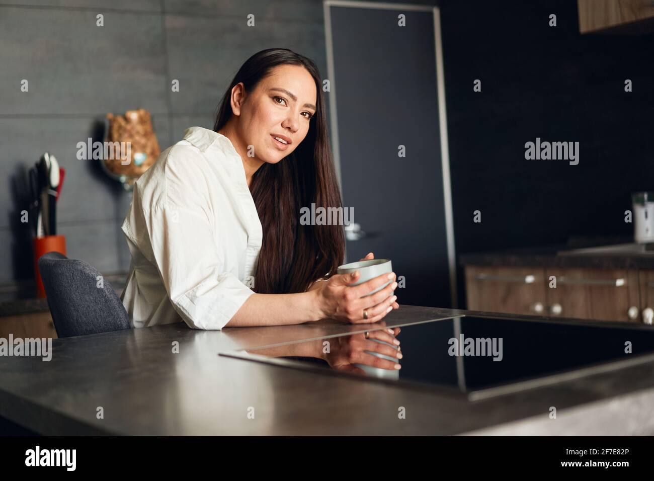 Caucasian woman home sitting kitchen hi-res stock photography and ...