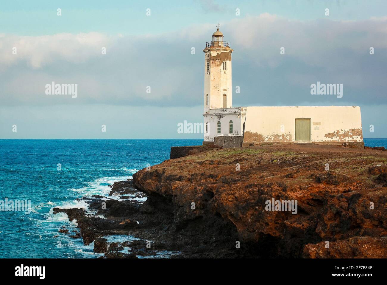 Lighthouse of Maria Pia with a cliff next to it, in the city of Praia ...