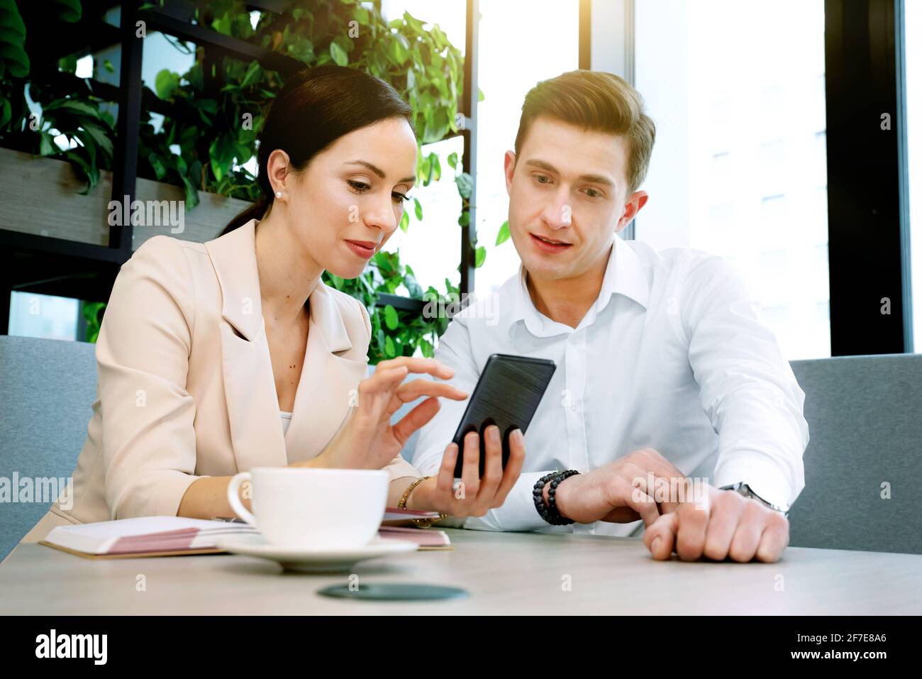 Colleagues discuss at the business meeting. Business people at work ...