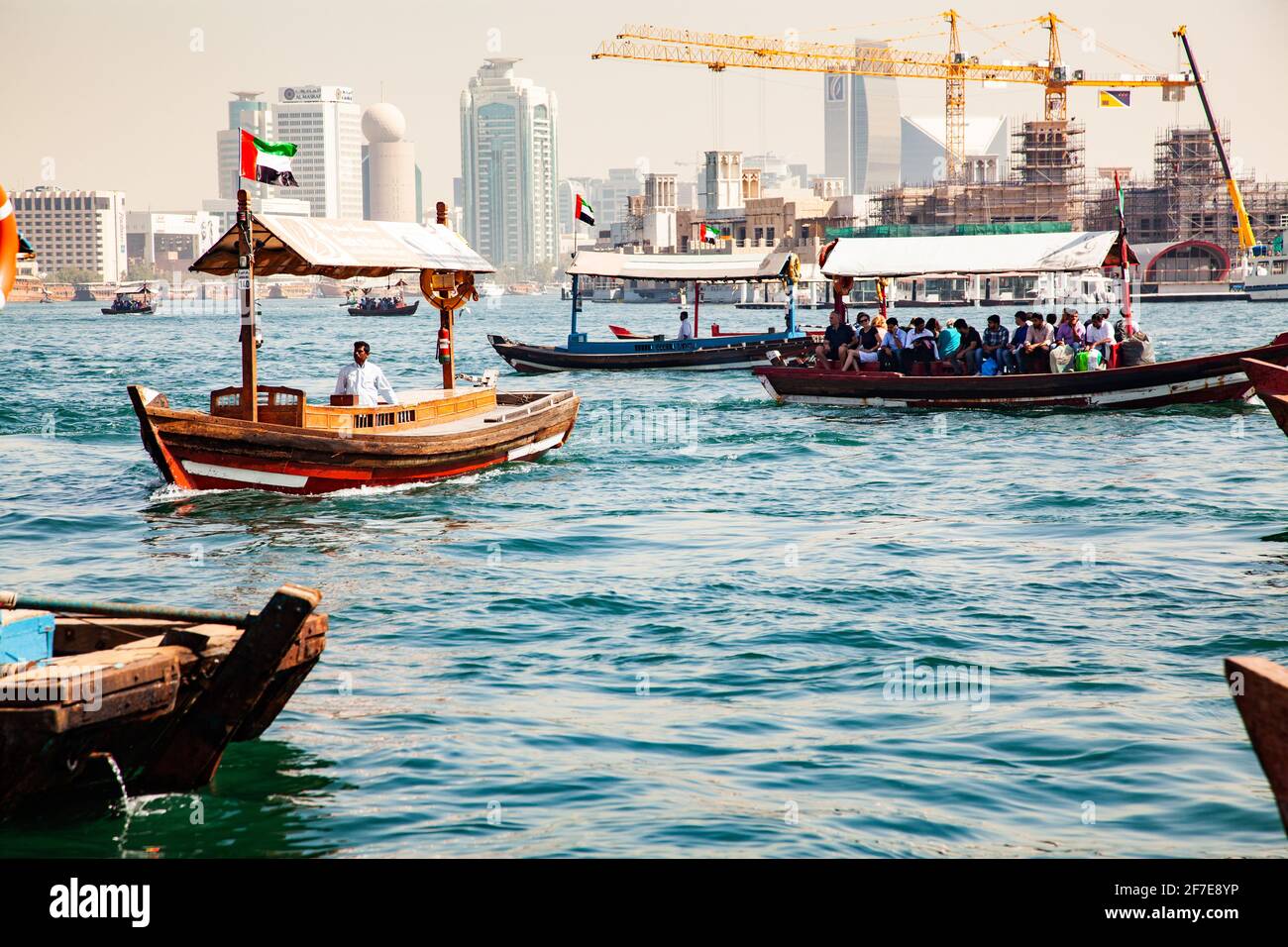 DUBAI, UAE- FEBRUARY 2018: Traditional Abra ferries crossing Dubai ...