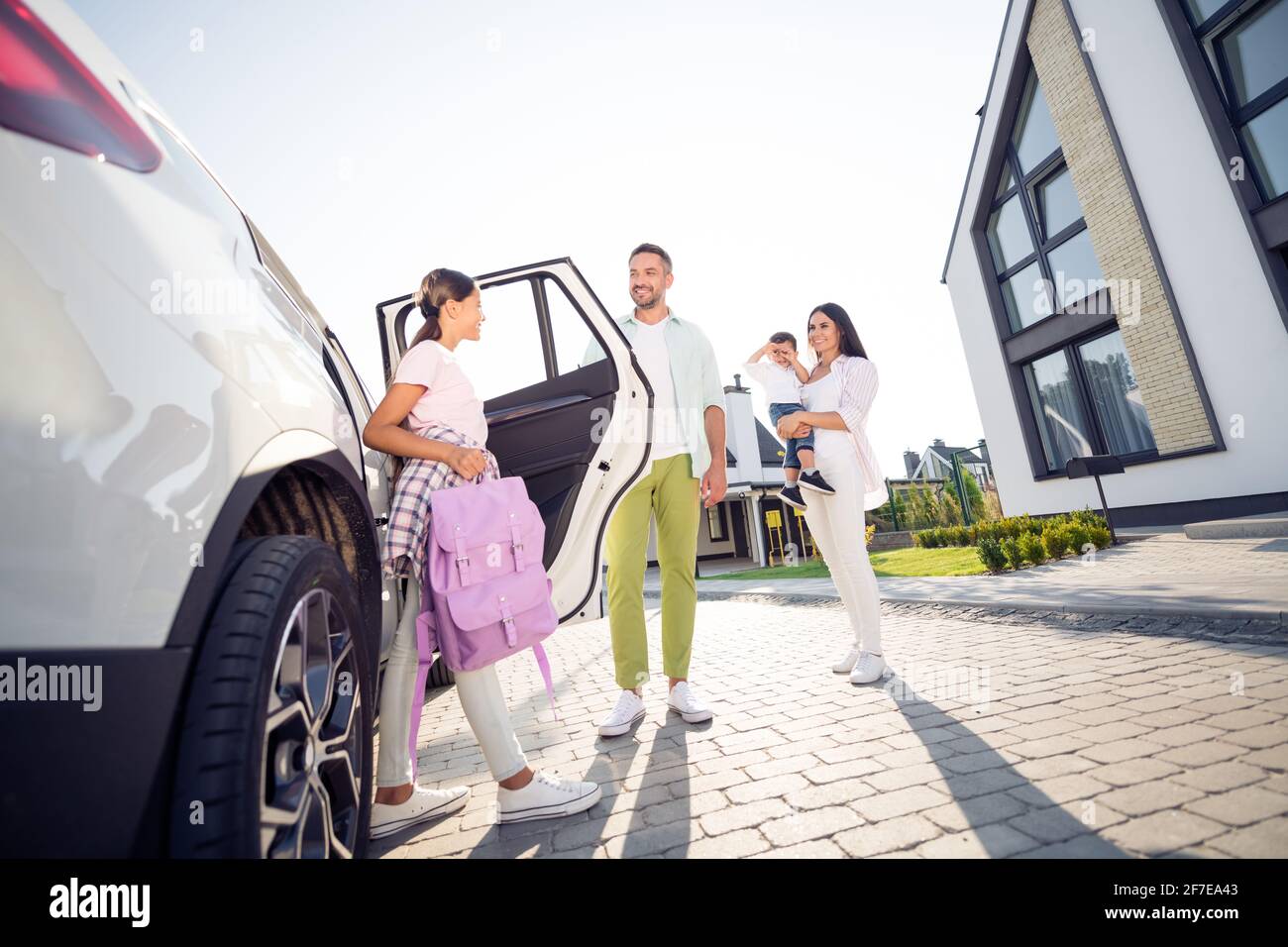 Full size photo of smiling happy family daughter come back home from ...