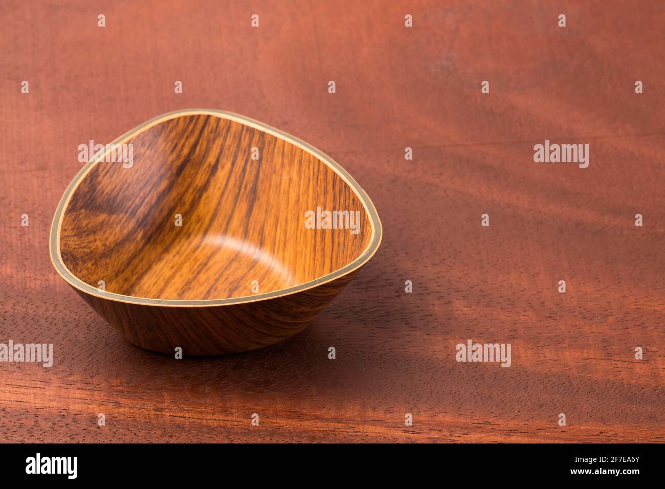 Wooden triangular bowl - Top view Stock Photo - Alamy