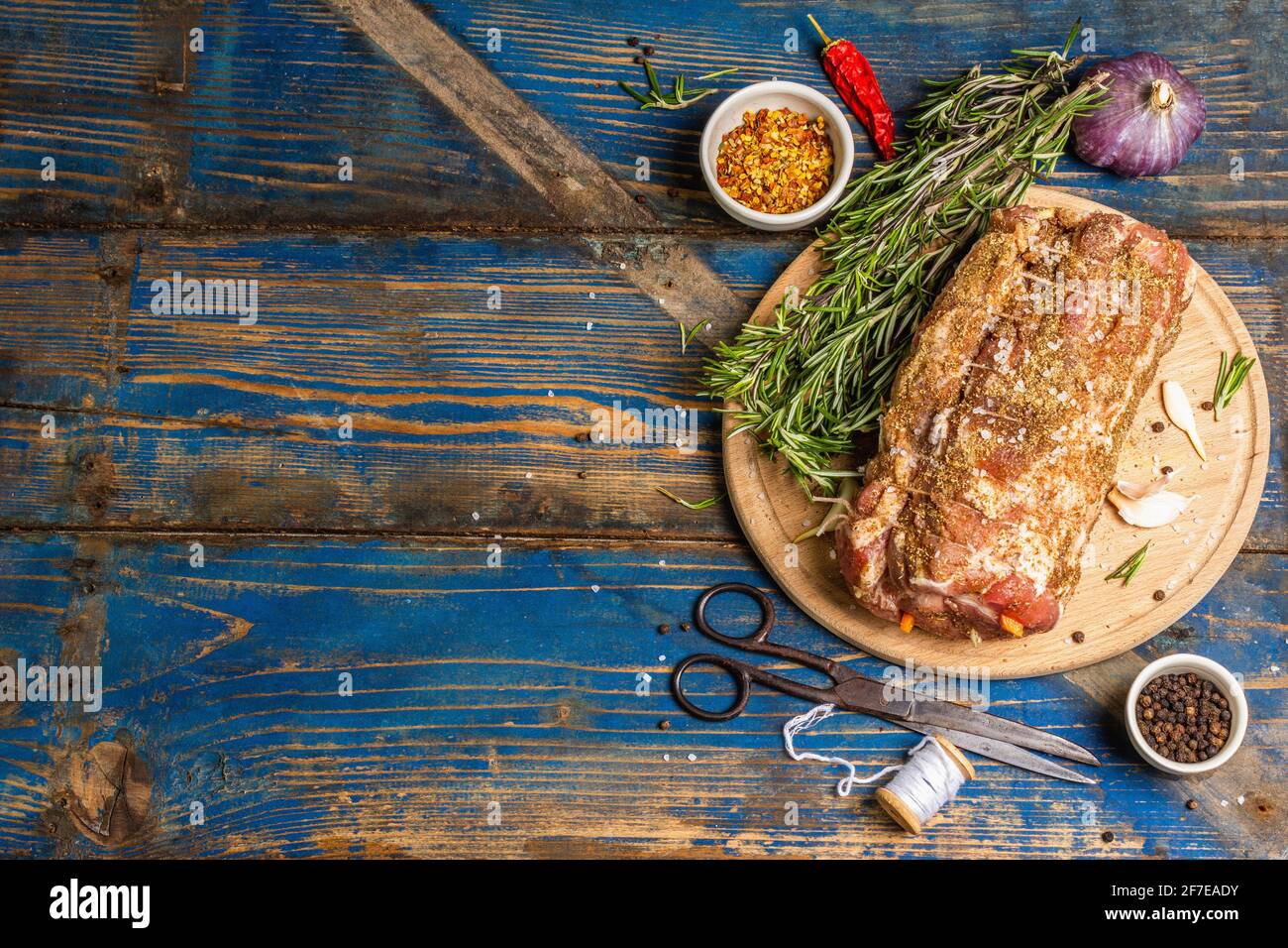 Raw pork roll stuffed with garlic and carrots. Fresh meat ready for ...