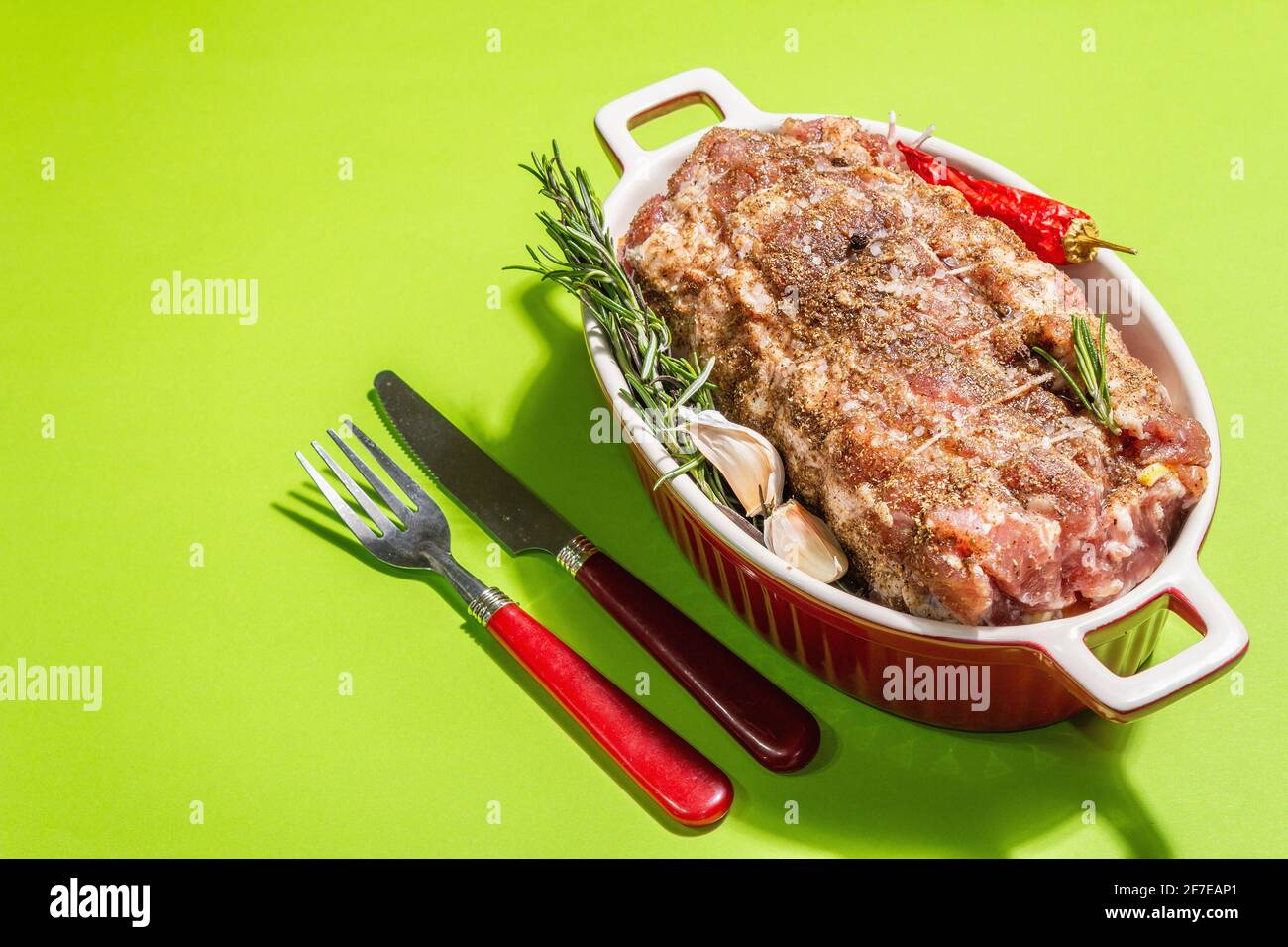 Raw Pork Roll Stuffed With Garlic And Carrots In A Ceramic Roasting 5523