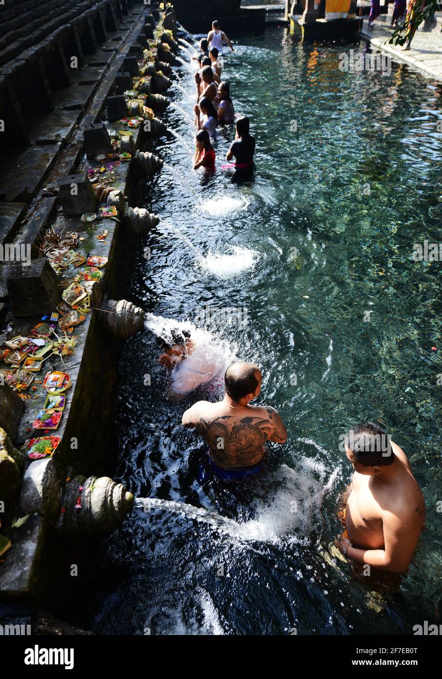 Balinese people purifying themselves at the purifying bath at the Tirta ...