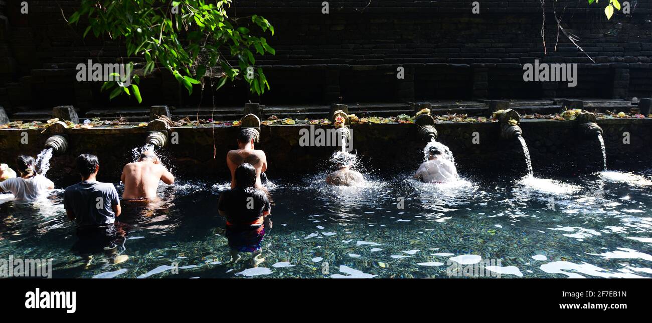 Balinese people purifying themselves at the purifying bath at the Tirta ...