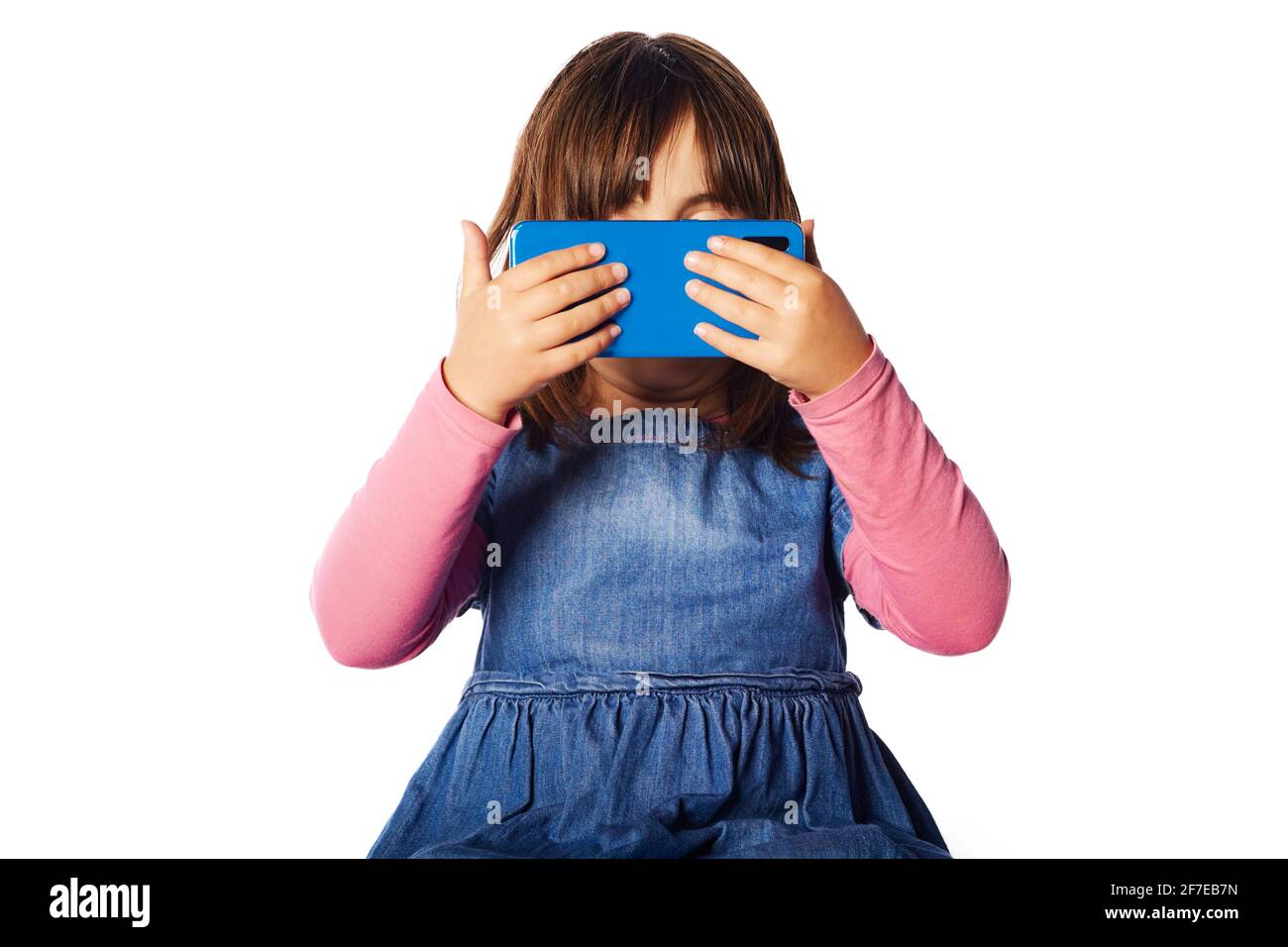 young girl looking at the cell phone obsessed Child technology ...