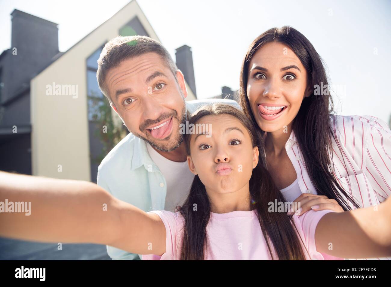 Photo of young happy positive smiling cheerful family take selfie ...