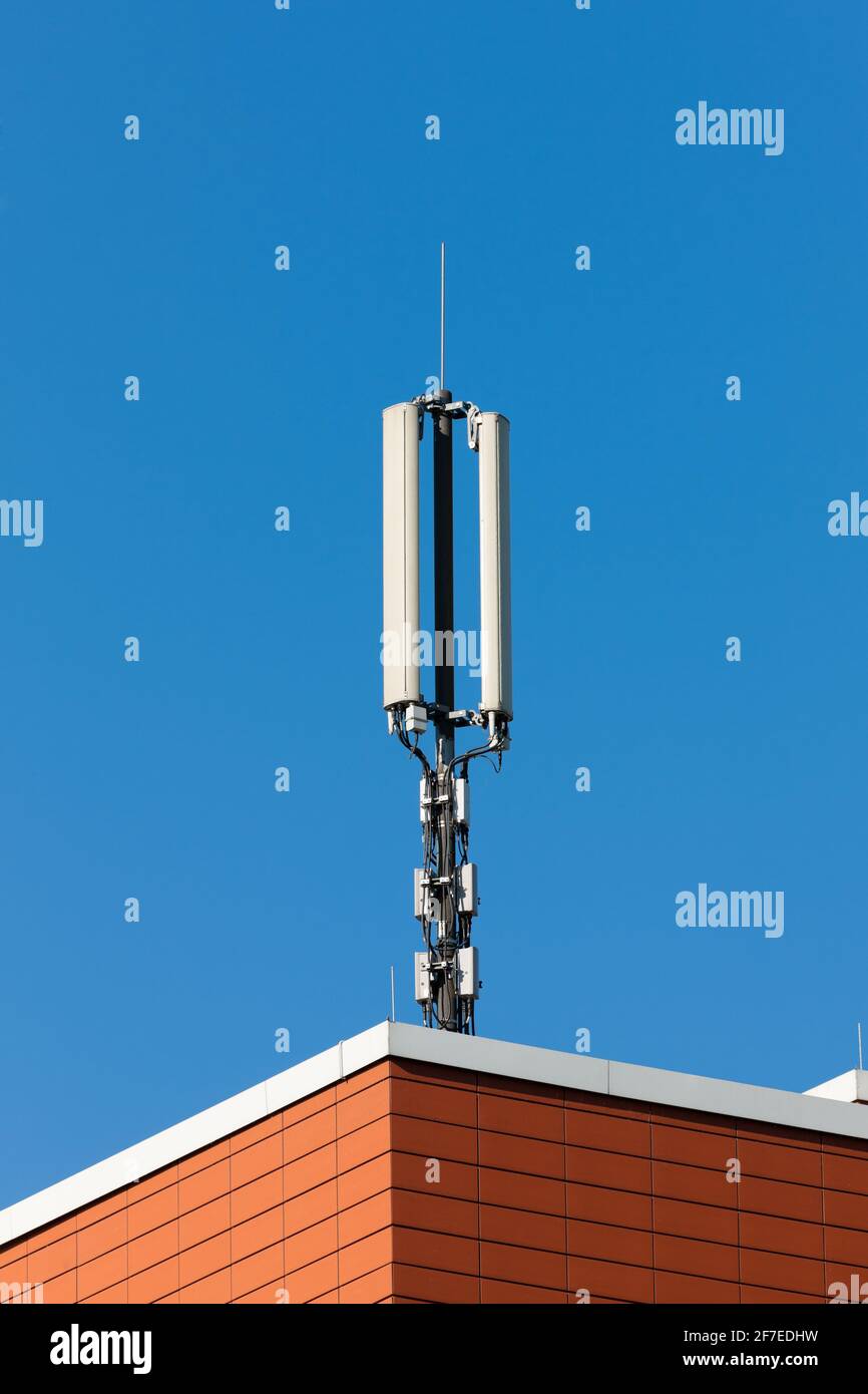 Mobile phone tower on the roof of a house Stock Photo - Alamy