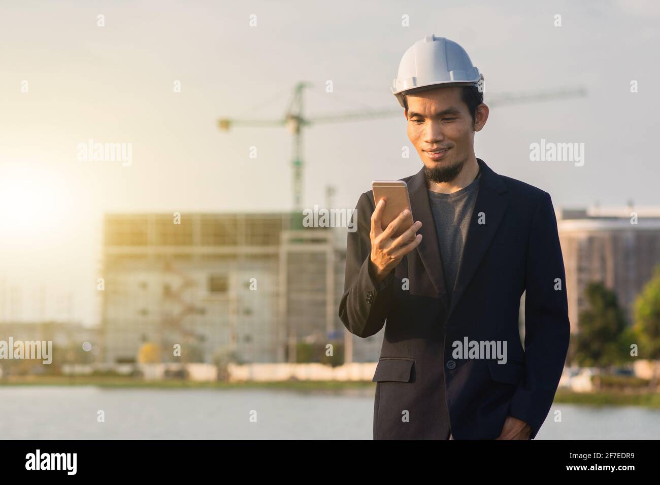 Asian man business use cell phone smile happy smart life work balance ...