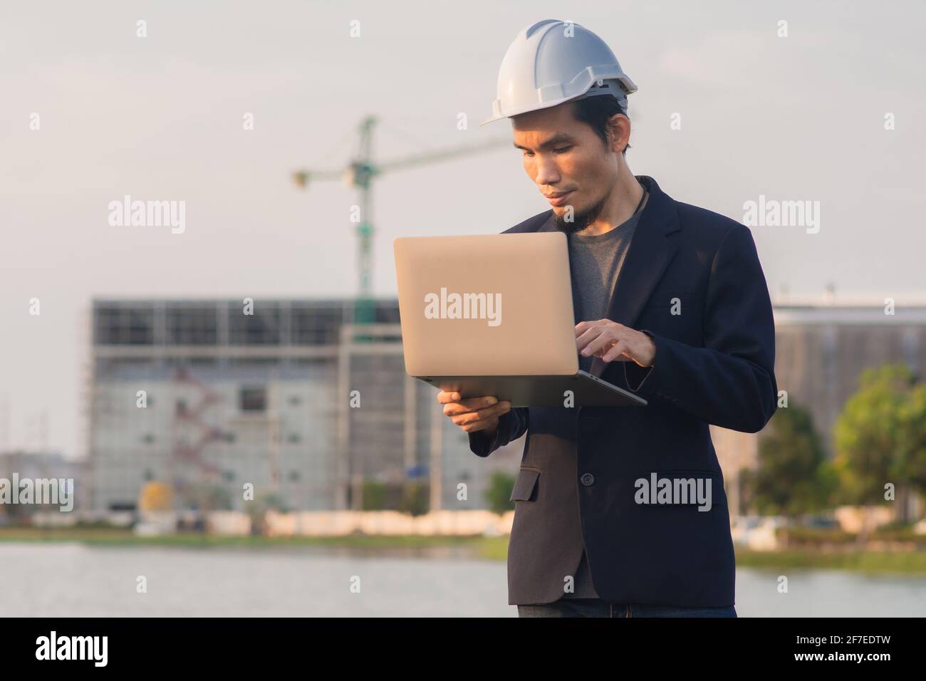 Business working laptop computer technology survey on site construction ...