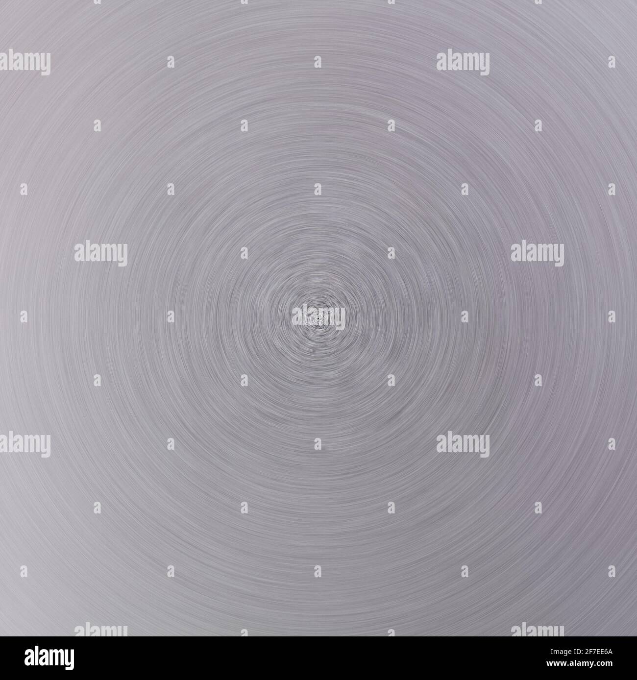 Circle of brushed aluminum metal in defocused blur motion abstract ...