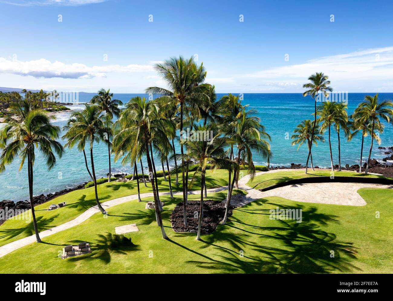 Leisurely stone pathway along the shoreline of tropical Hawaii Island ...