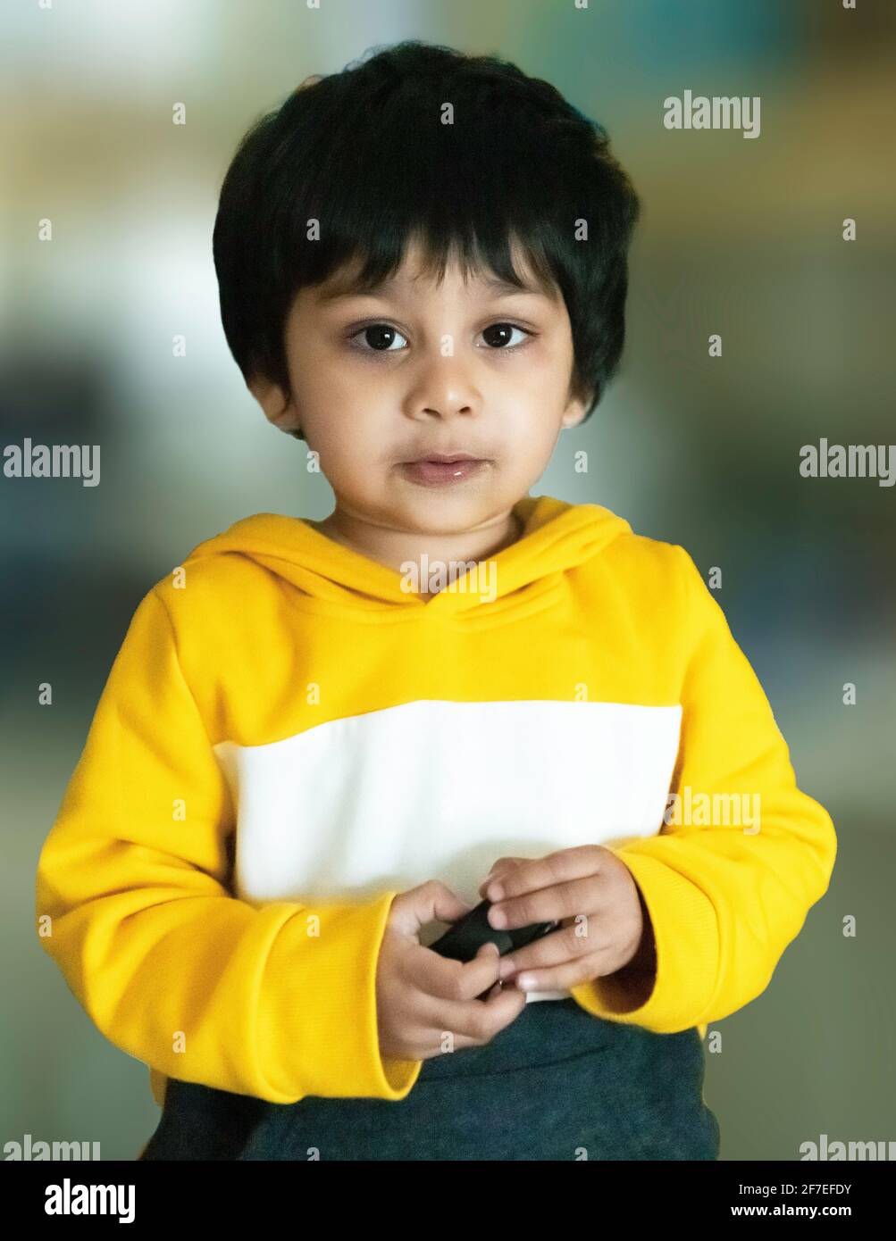 Child in Yellow Stock Photo - Alamy